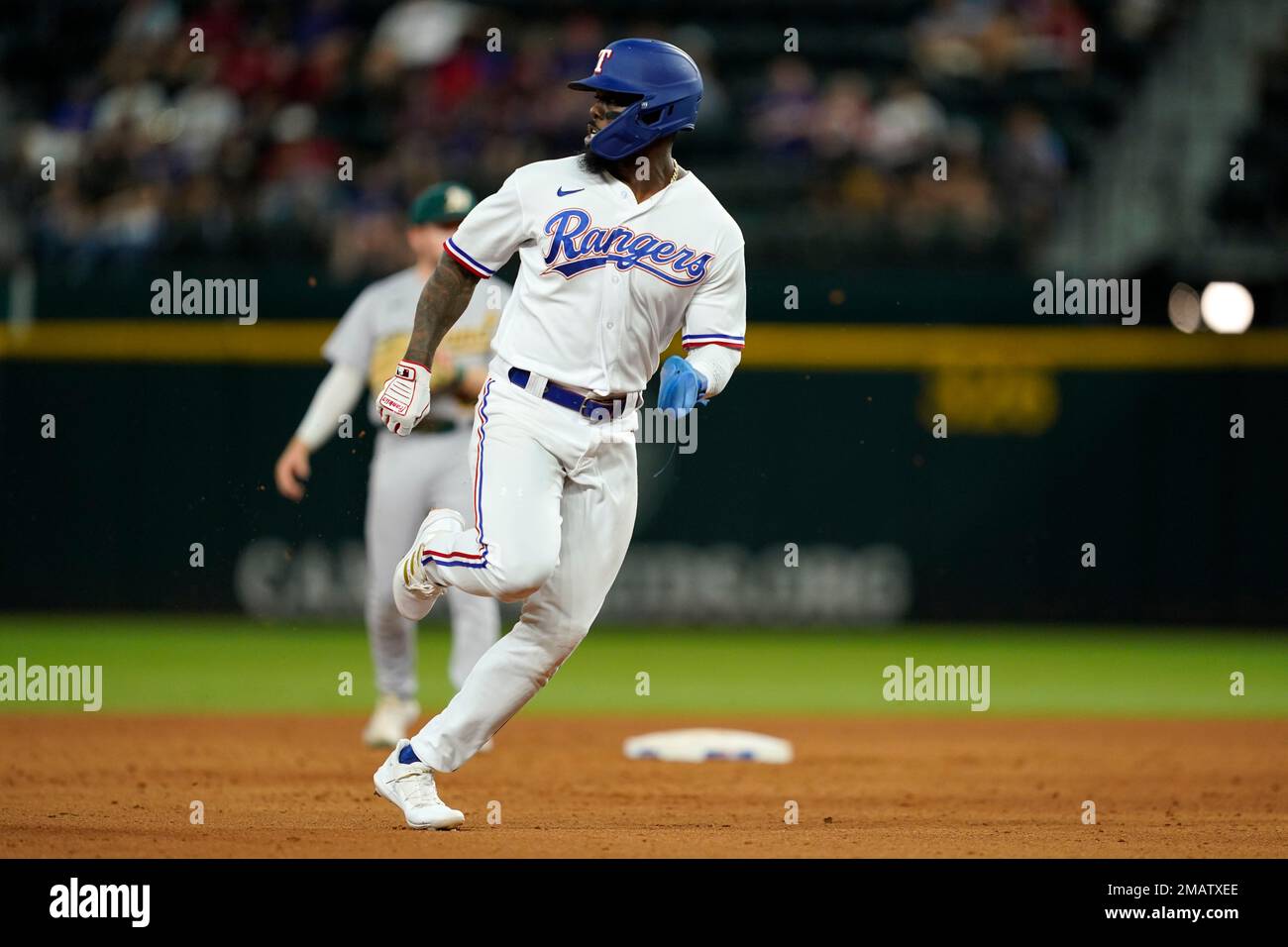 Texas Rangers' Adolis Garcia sprints to third during a baseball game ...