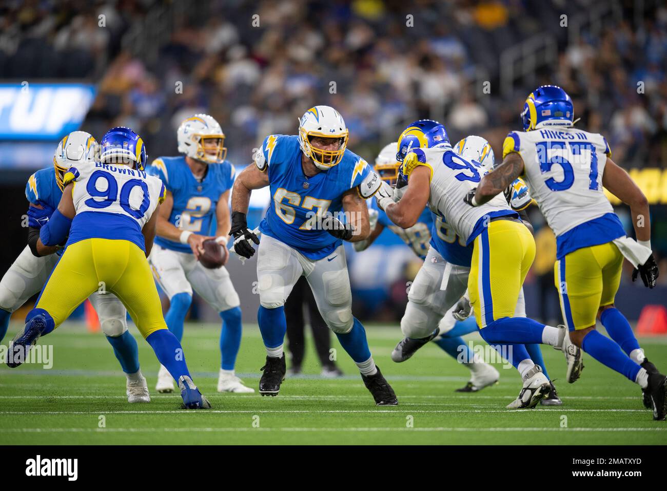 Los Angeles Chargers Ryan Hunter (67) blocks Los Angeles Rams defenders ...