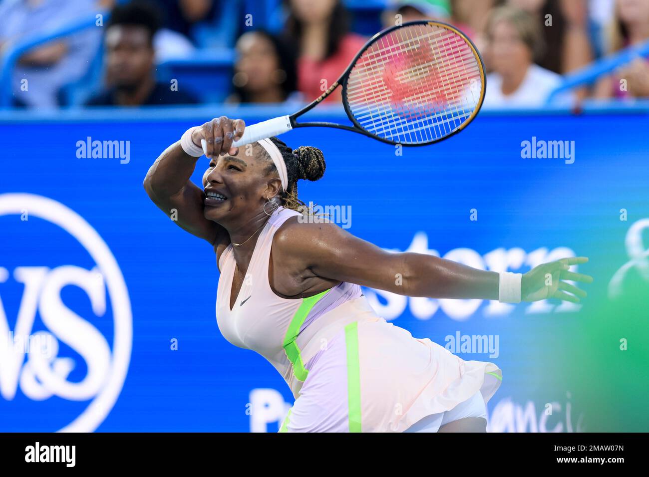 Serena Williams, of the United States, returns a shot to Emma Raducanu ...
