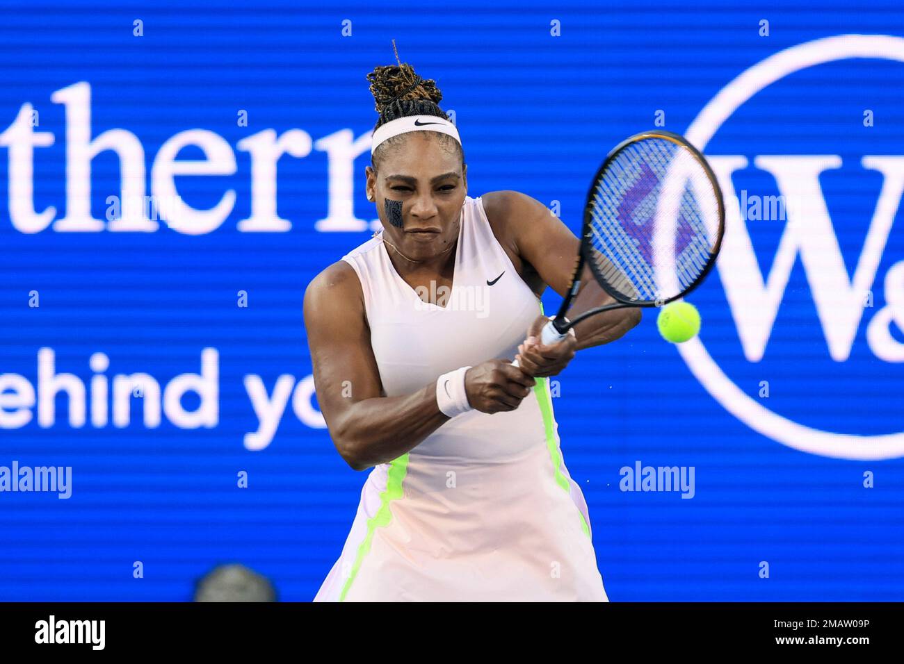 Serena Williams, of the United States, returns a shot to Emma Raducanu ...