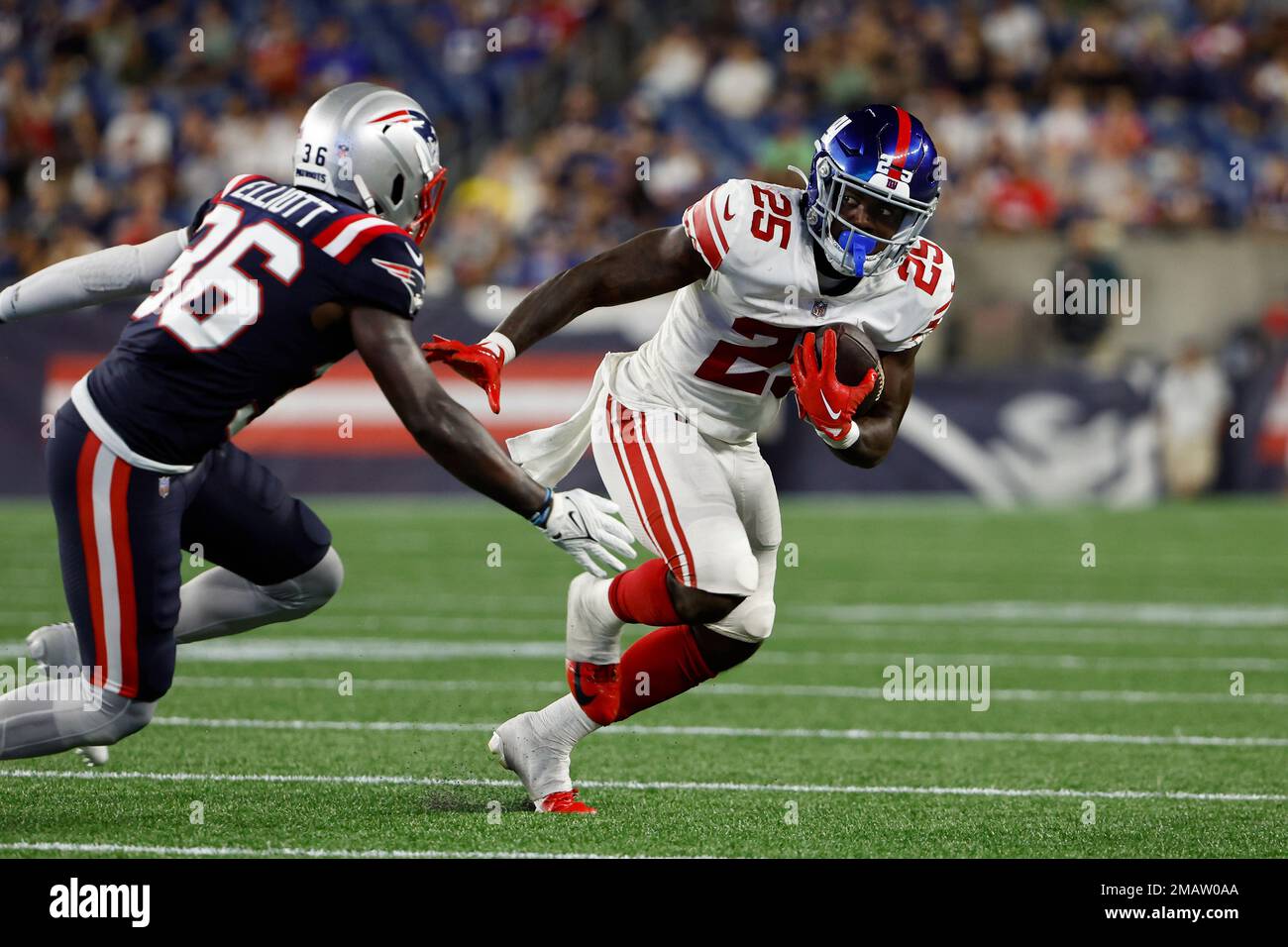 New York Giants' Jashaun Corbin runs against the New England Patriots ...