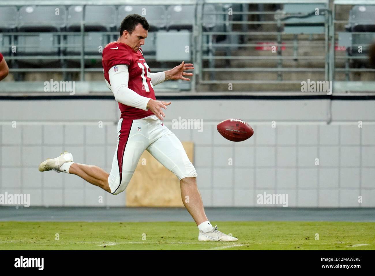Arizona Cardinals punter Nolan Cooney kicks the ball as he takes part ...
