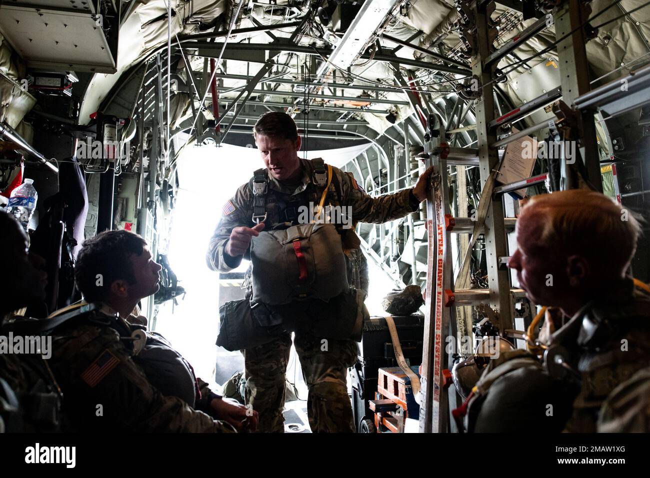 A U.S. Army jumpmaster assigned to the 173rd Airborne Brigade provides ...