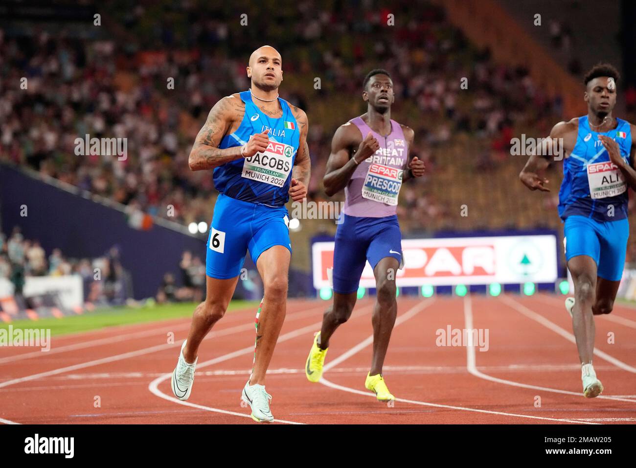 Lamont Marcell Jacobs, of Italy, left, wins the Men's 100 meters during ...