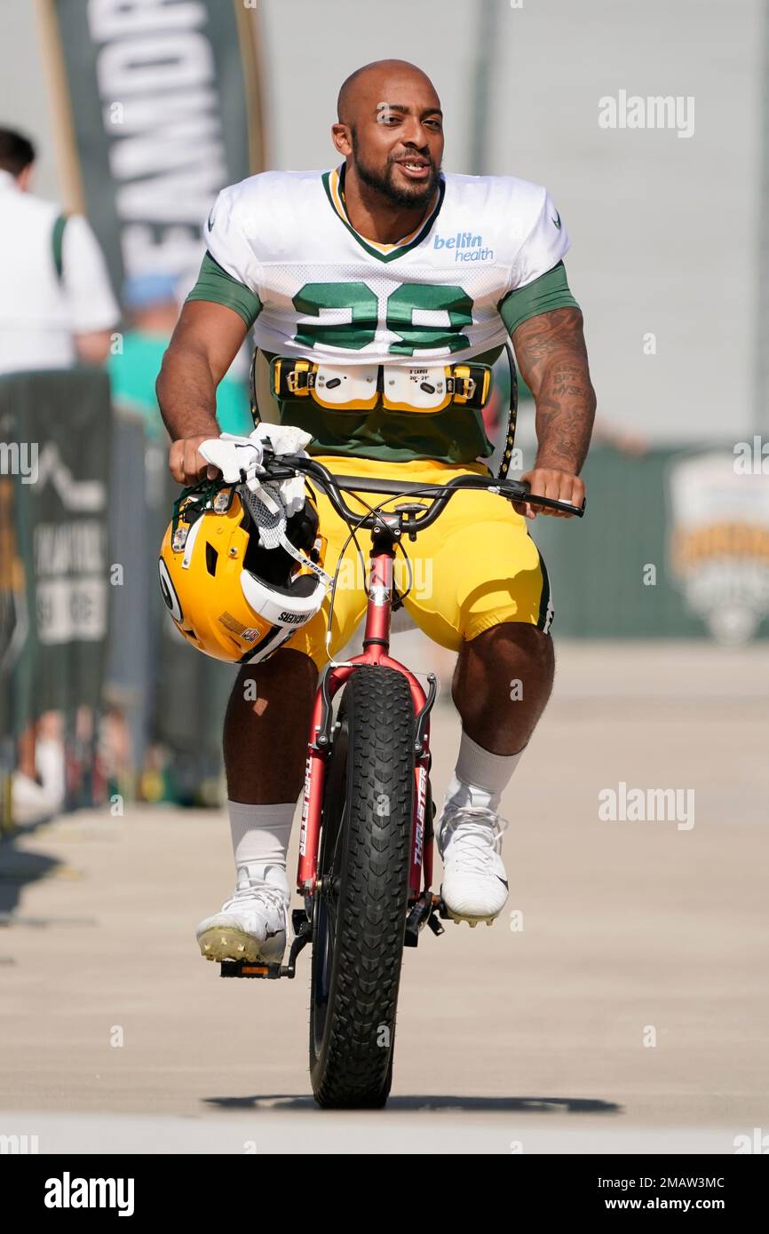 Green Bay Packers' AJ Dillon rides a bike to an NFL football joint ...