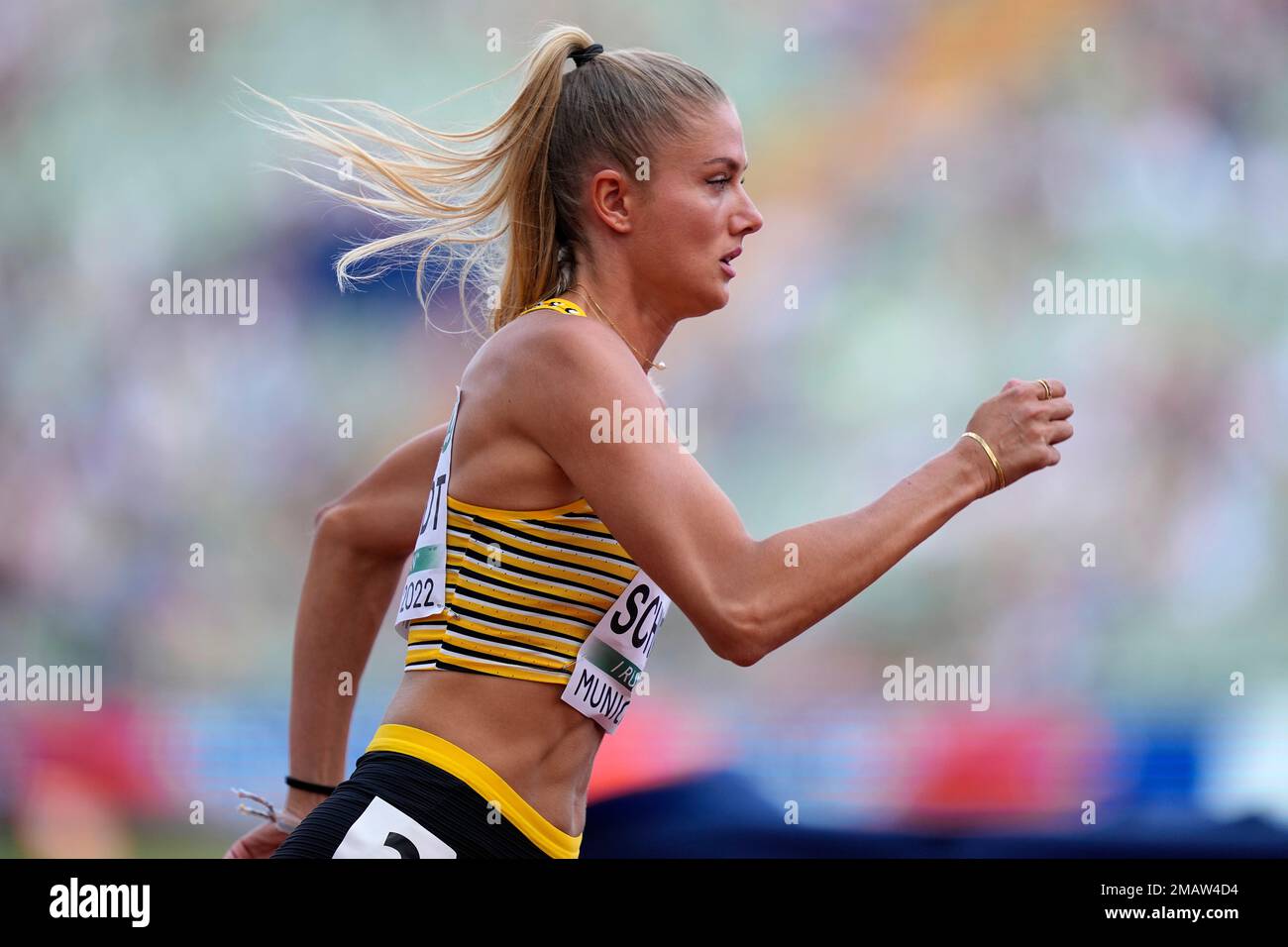 Alica Schmidt, of Germany, competes in a Women's 400 meters semifinal ...