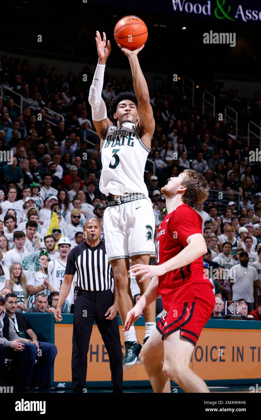 Michigan State's Jaden Akins (3) shoots against Rutgers' Cam Spencer ...