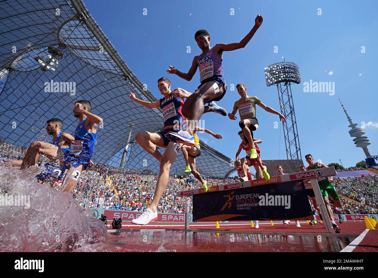 Athletes compete in a Men's 3000 meters steeplechase heat during the ...