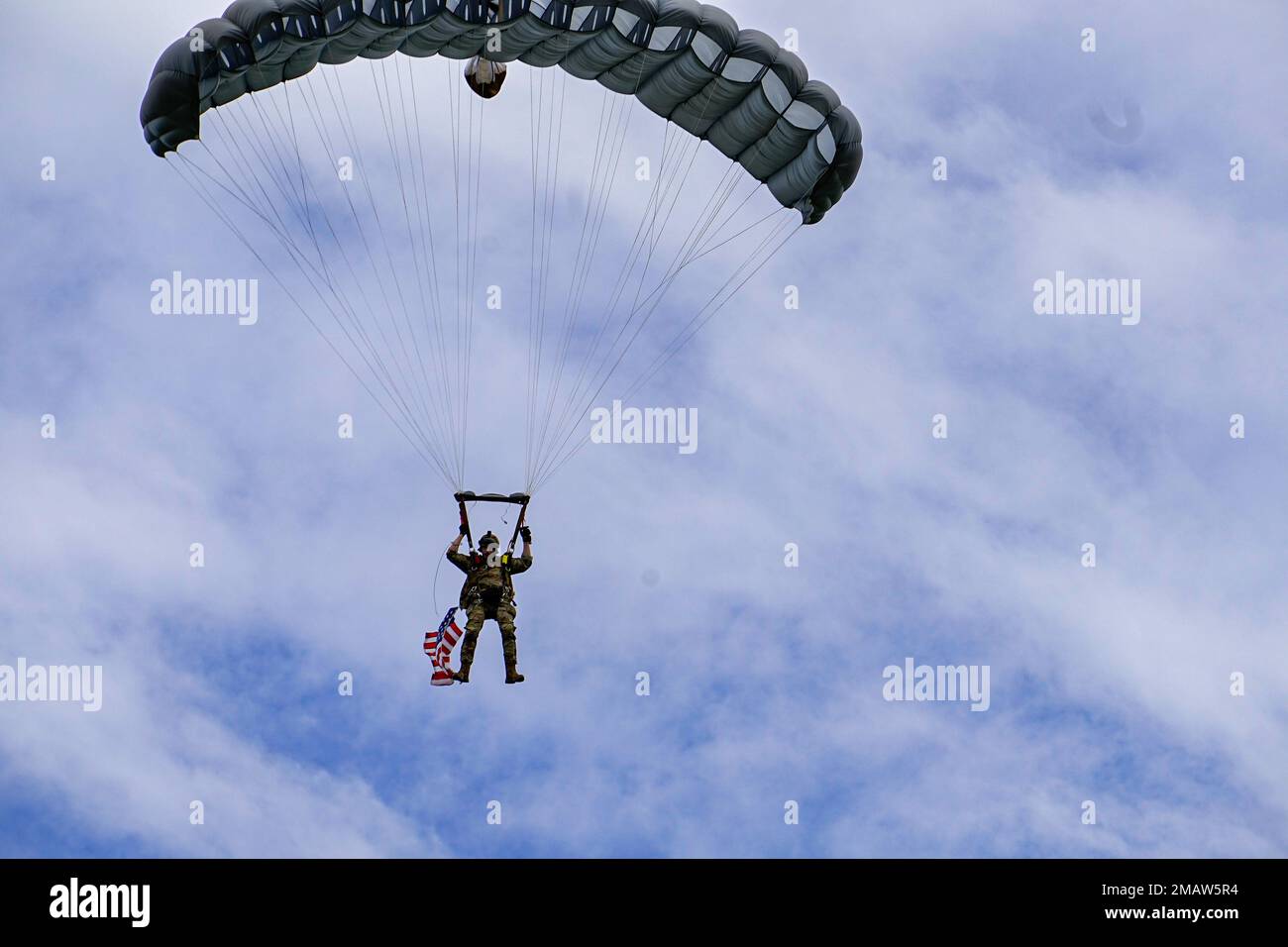 A U.S. Army Airborne soldier glides into a drop zone in Normandy ...