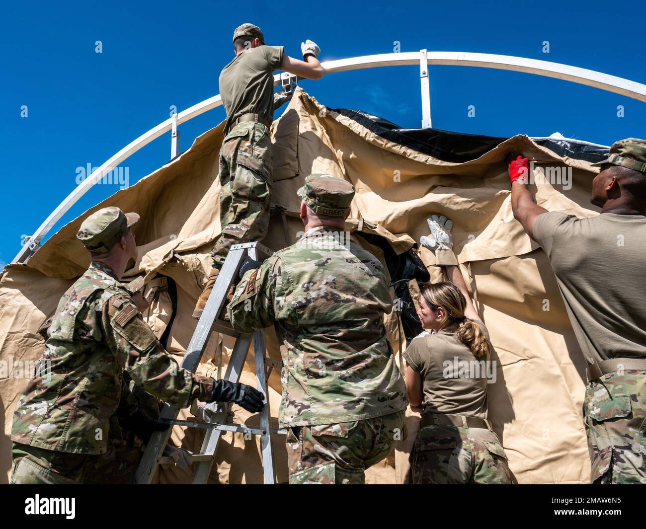 Airmen with the 914th Aeromedical Staging Squadron construct a tent to ...