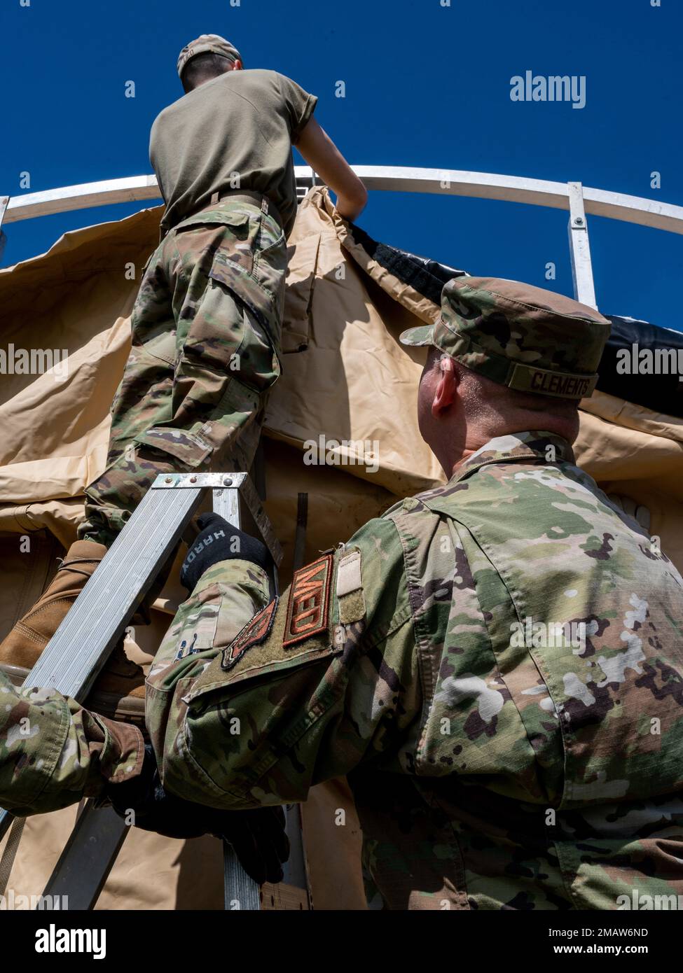 Airmen with the 914th Aeromedical Staging Squadron construct a tent to ...