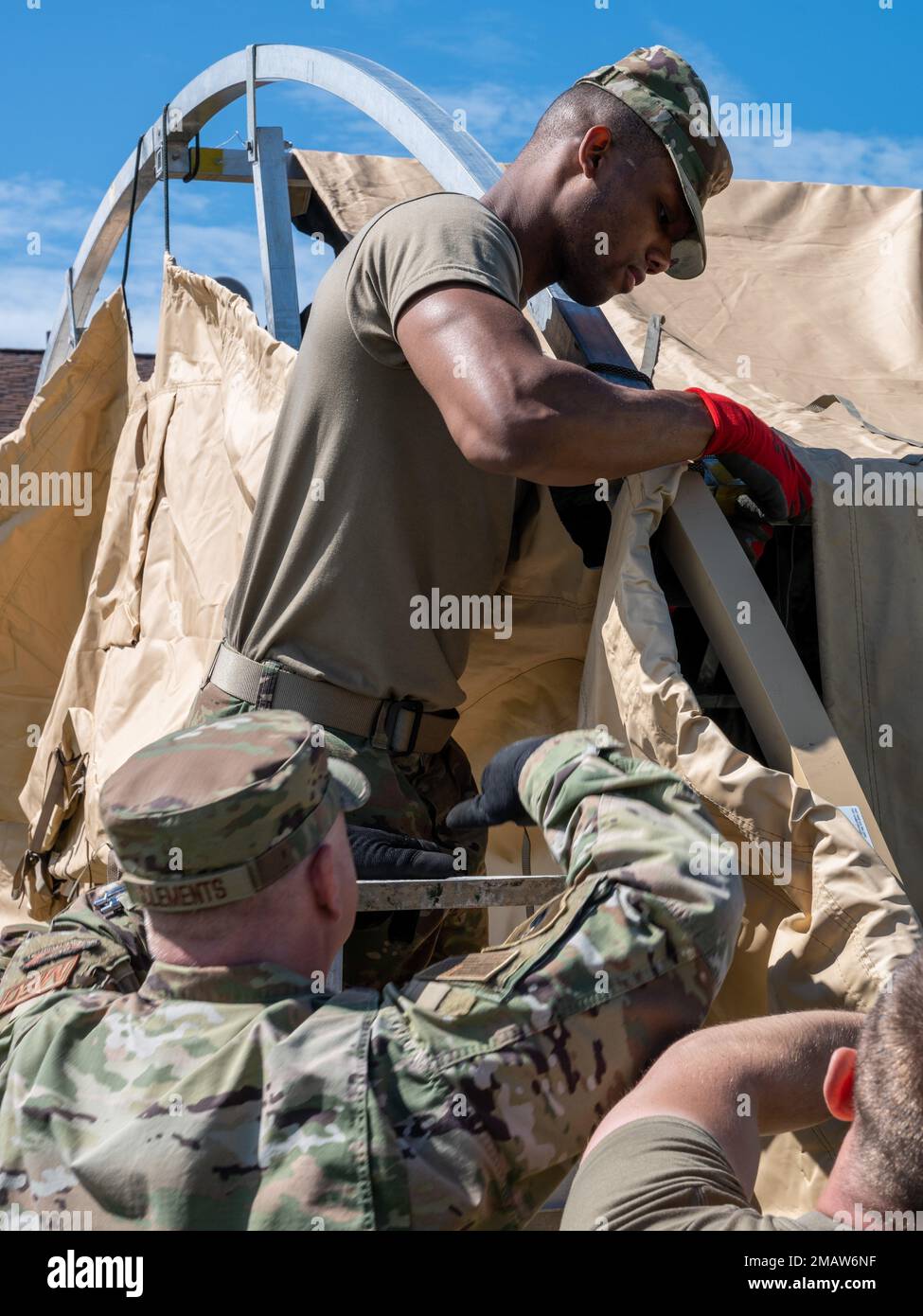 Airmen with the 914th Aeromedical Staging Squadron construct a tent to ...