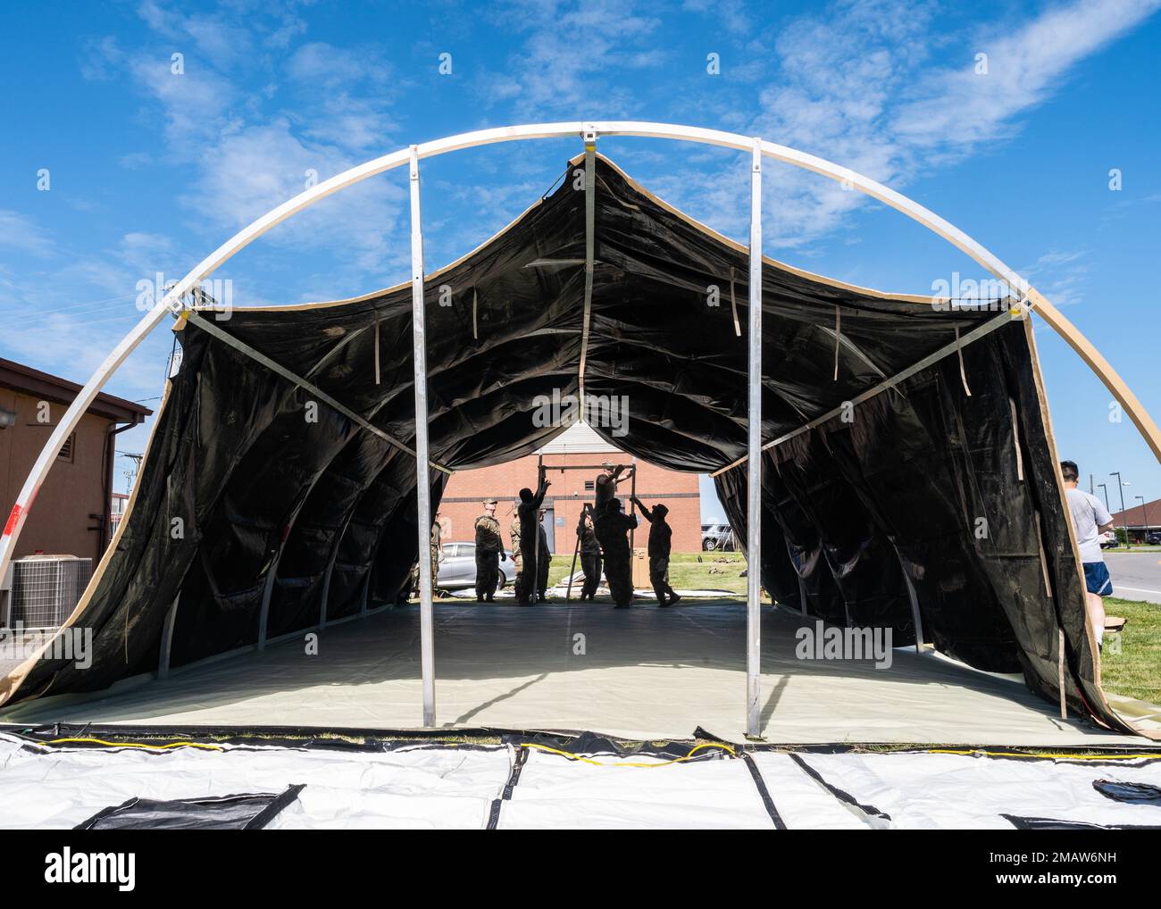 Airmen with the 914th Aeromedical Staging Squadron construct a tent to ...