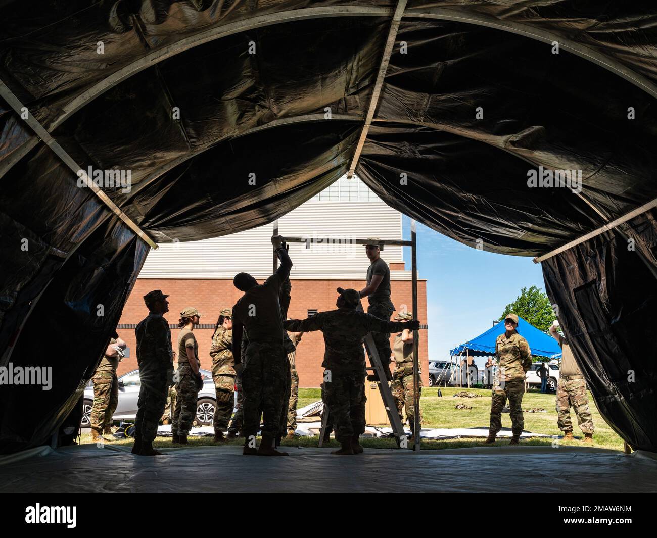 Airmen with the 914th Aeromedical Staging Squadron construct a tent to ...