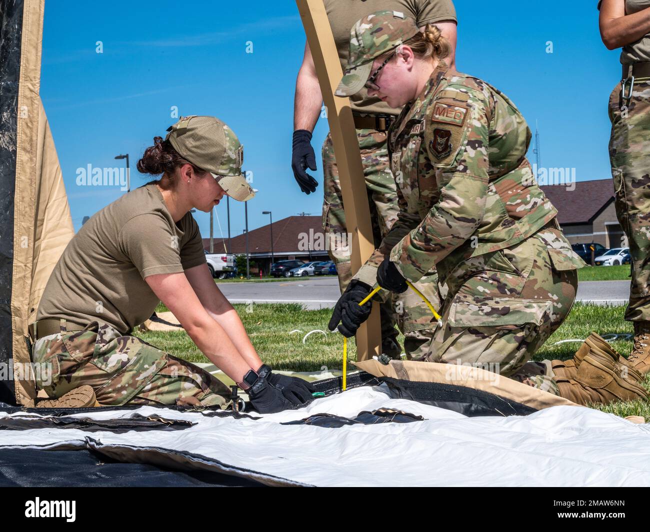 Airmen with the 914th Aeromedical Staging Squadron construct a tent to ...