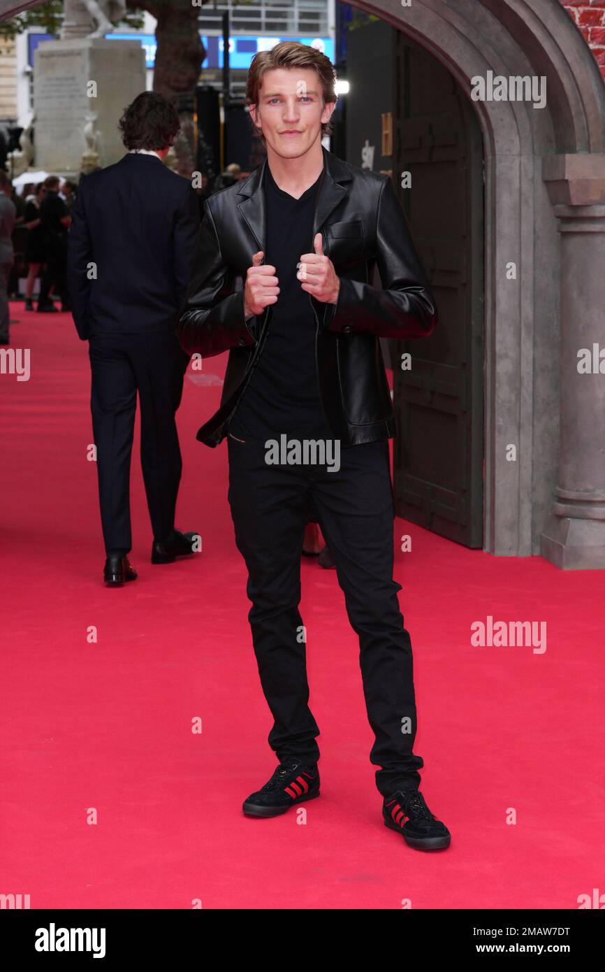 Ewan Mitchell poses for photographers upon arrival for the premiere of ...