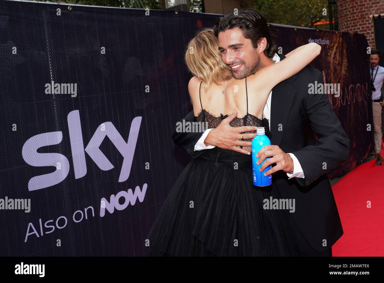 Milly Alcock greets Fabien Frankel upon arrival for the premiere of the ...