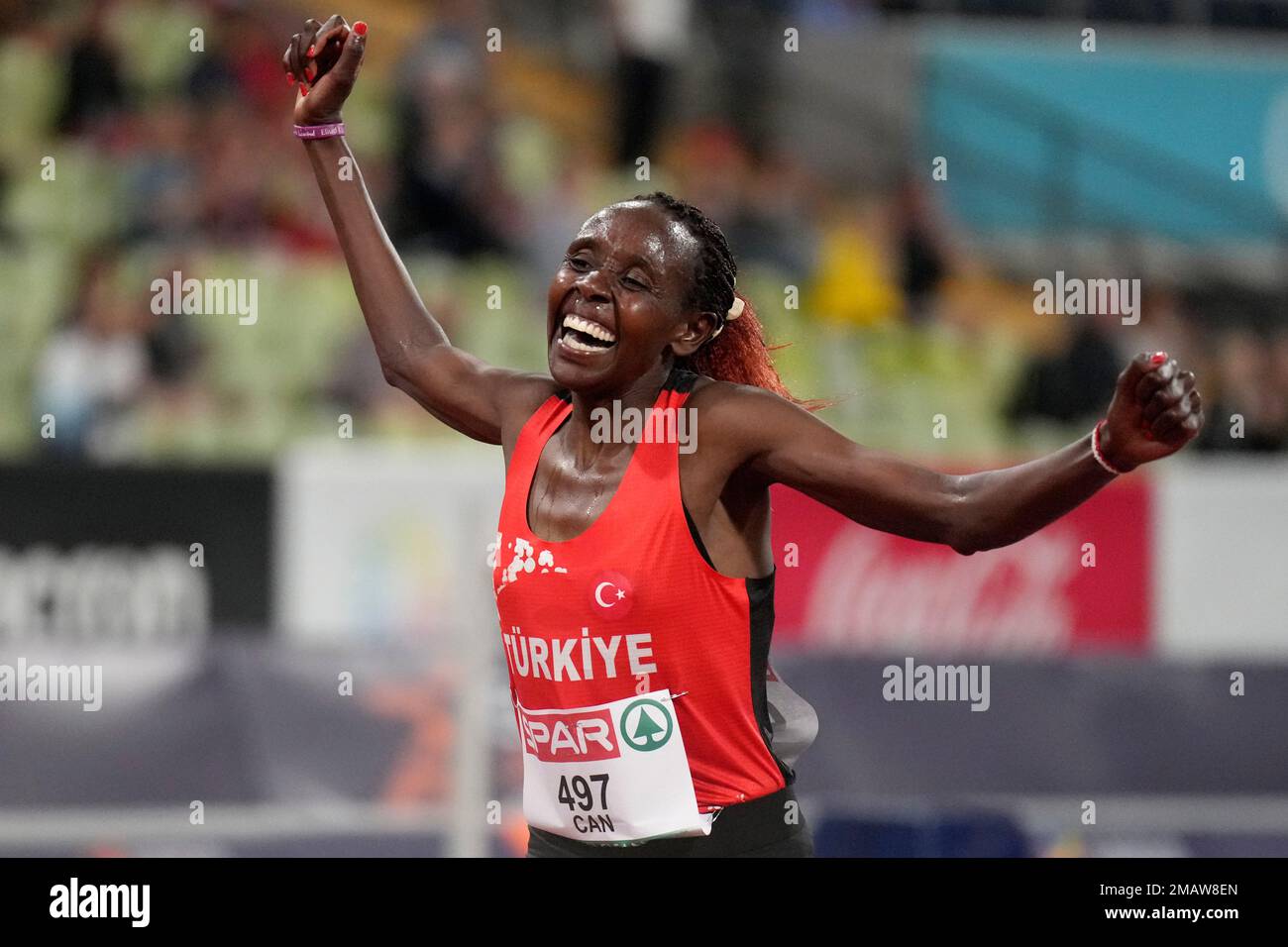 Yasemin Can, of Turkey, crosses the finish line to win the gold medal ...