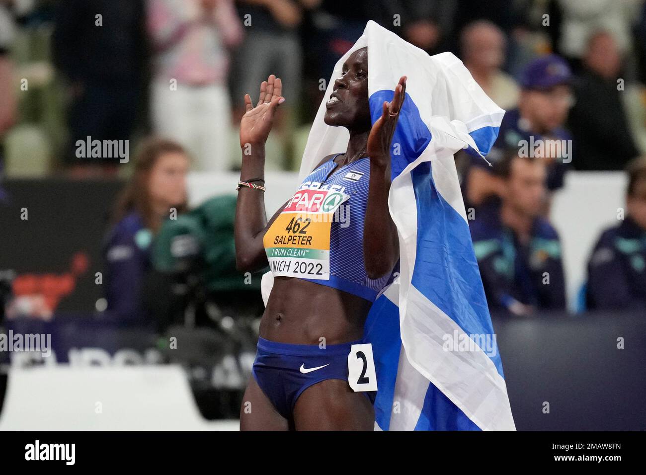 Lonah Chemtai Salpeter, of Israel, celebrates after winning the bronze ...