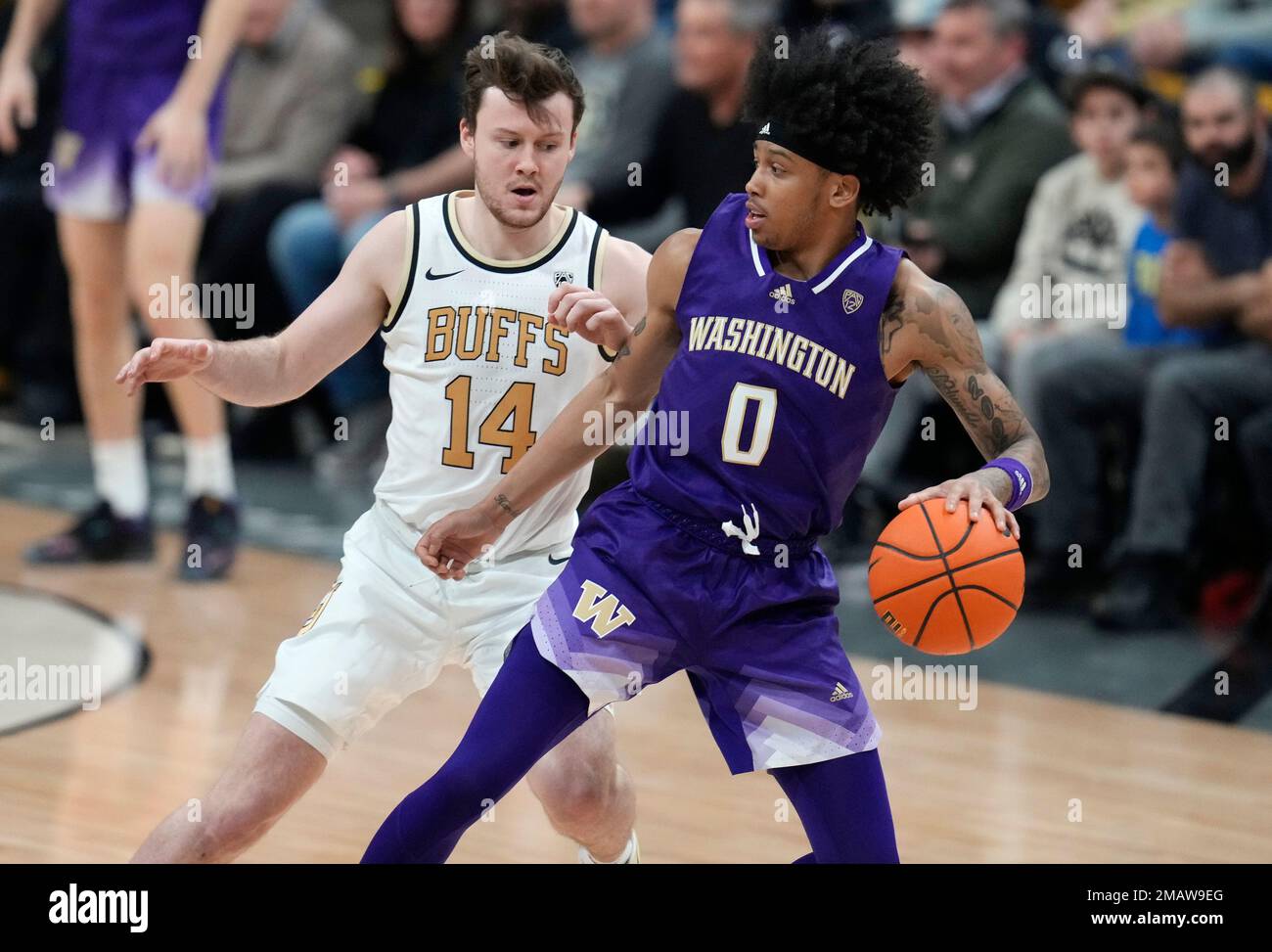 Washington guard Koren Johnson, right, looks to pass the ball as ...