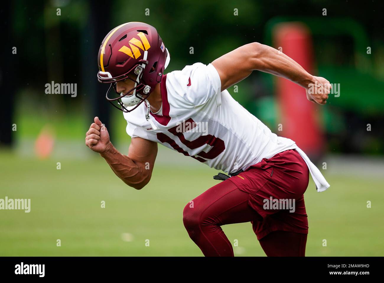 Washington Commanders wide receiver Dax Milne (15) runs a drill during ...