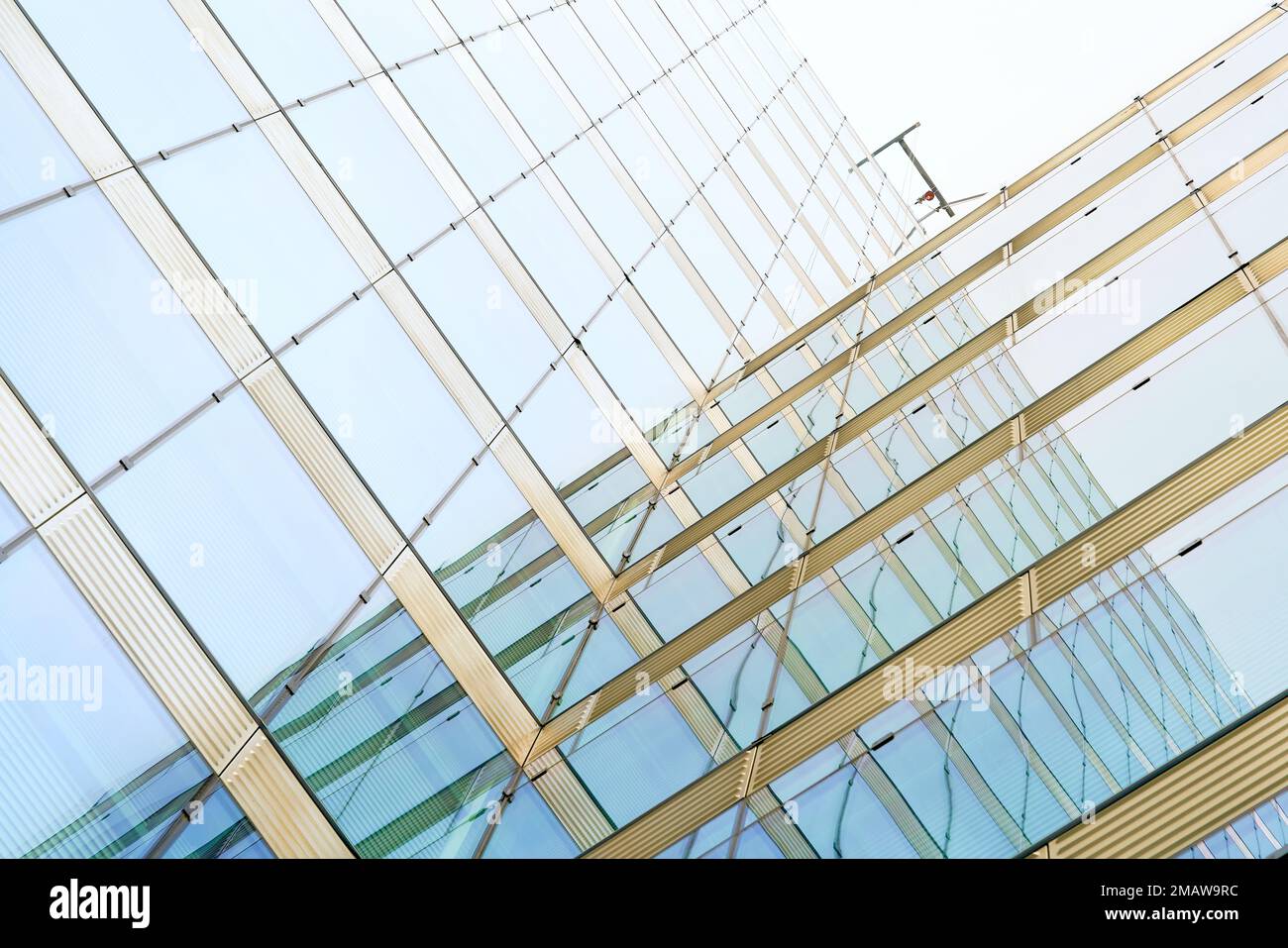 Reflection in the glass facade of two connected office buildings in ...