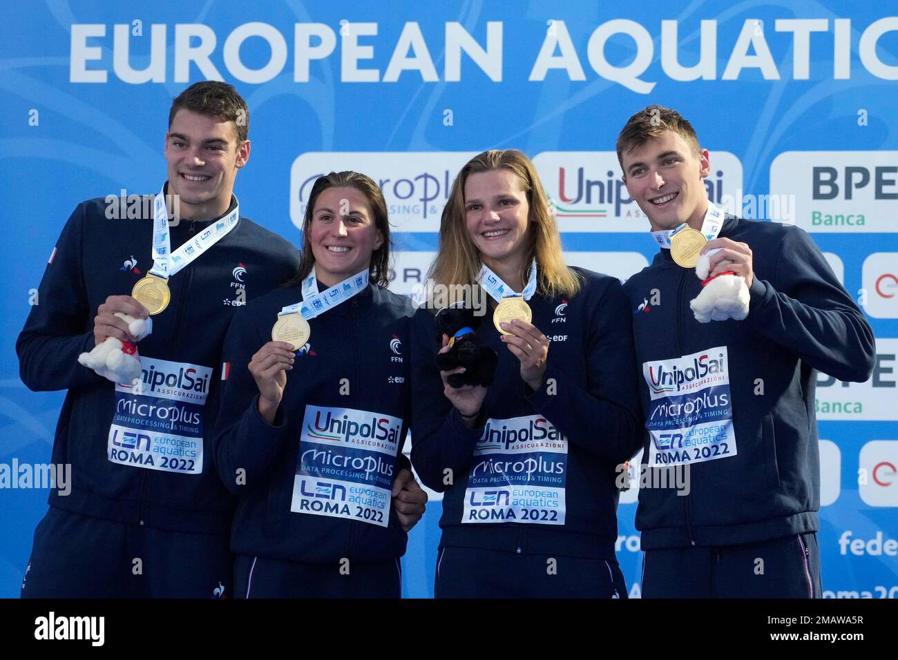 Team of France celebrates after winning the mixed 4x100m freestyle ...