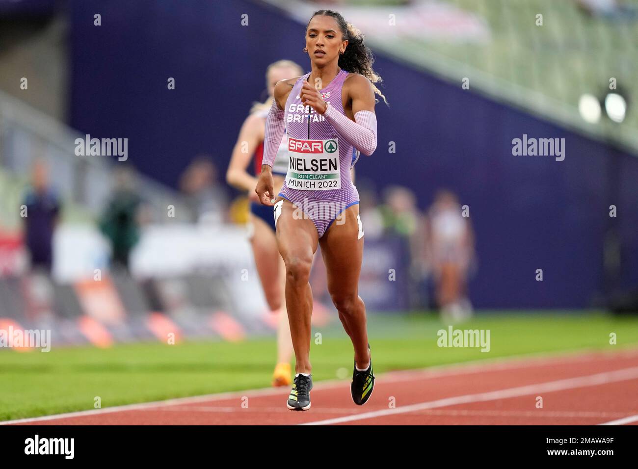 Laviai Nielsen, of Great Britain, runs to win a Women's 400 meters heat ...