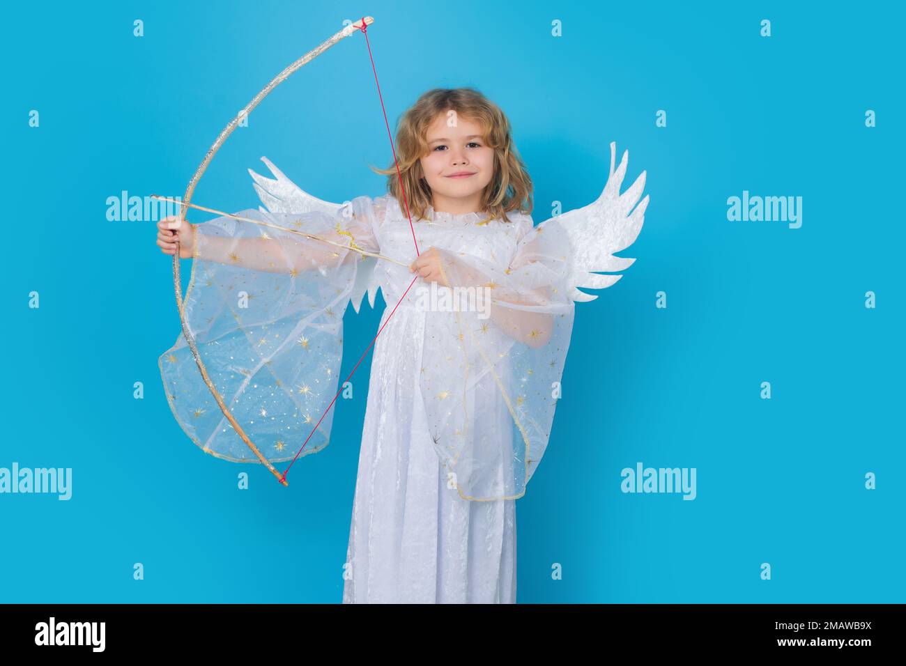 Angel kid shoots a love arrow from a bow on Valentines Day. Portrait of ...