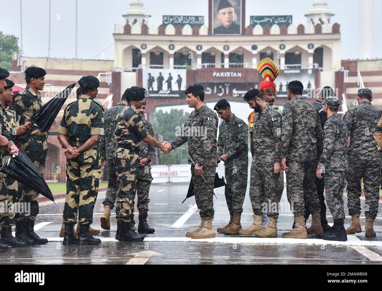 Indian Border Security Force (BSF) commandant Jasbir Singh, left shakes ...