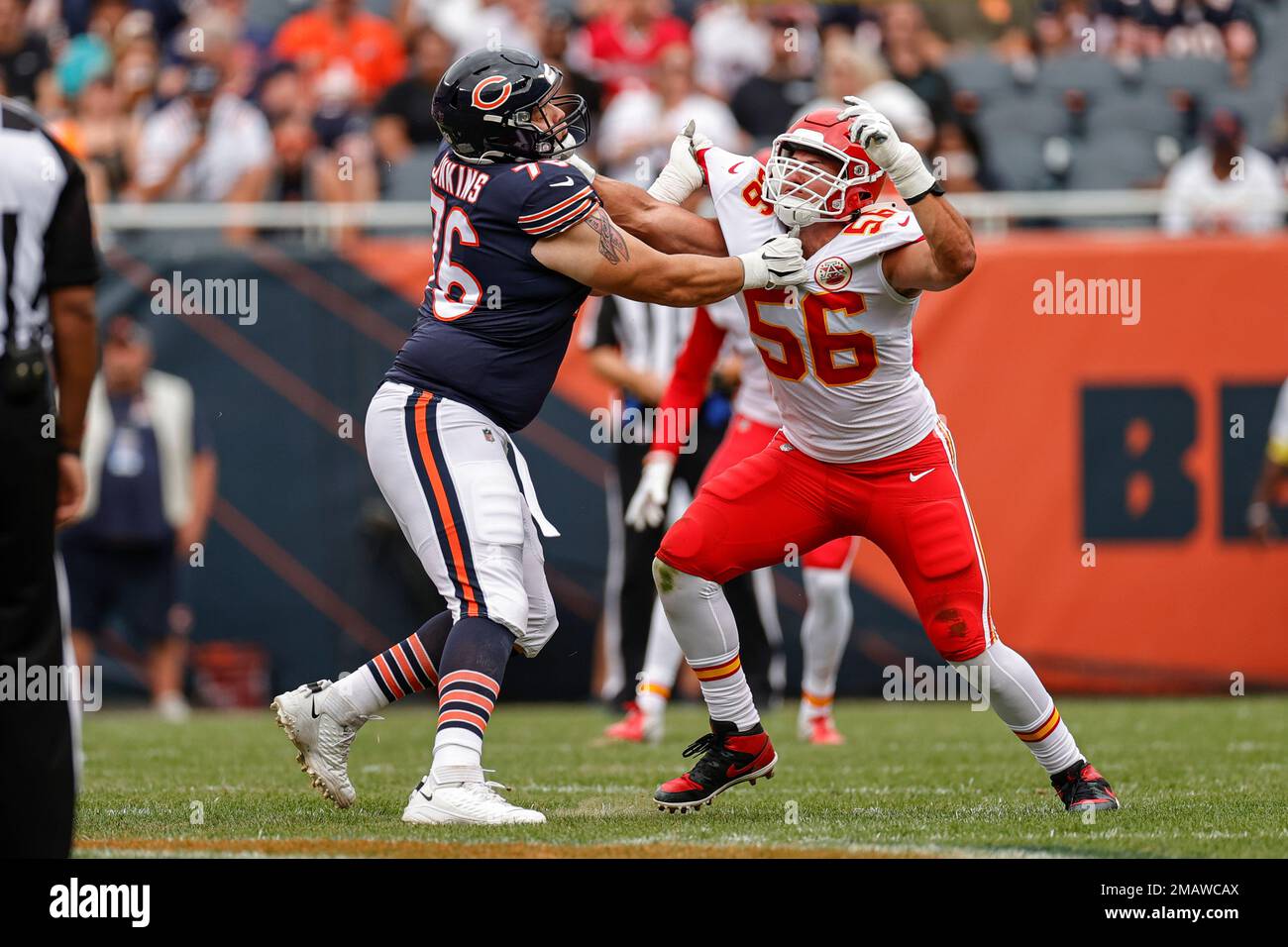 Chicago Bears offensive tackle Teven Jenkins, left, fights for the ...
