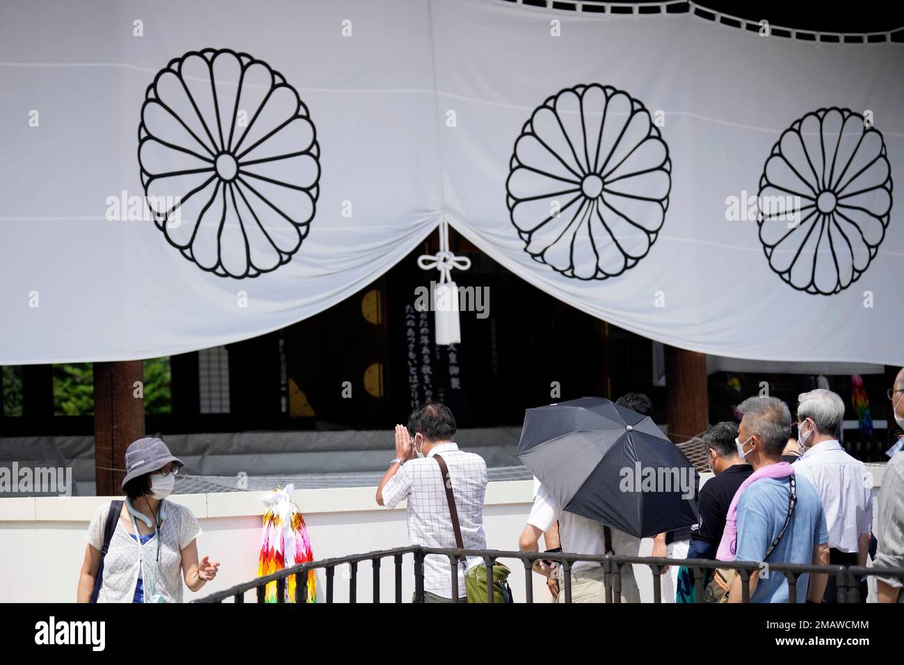 People pay respects to the war dead at Yasukuni Shrine Monday, Aug. 15 ...