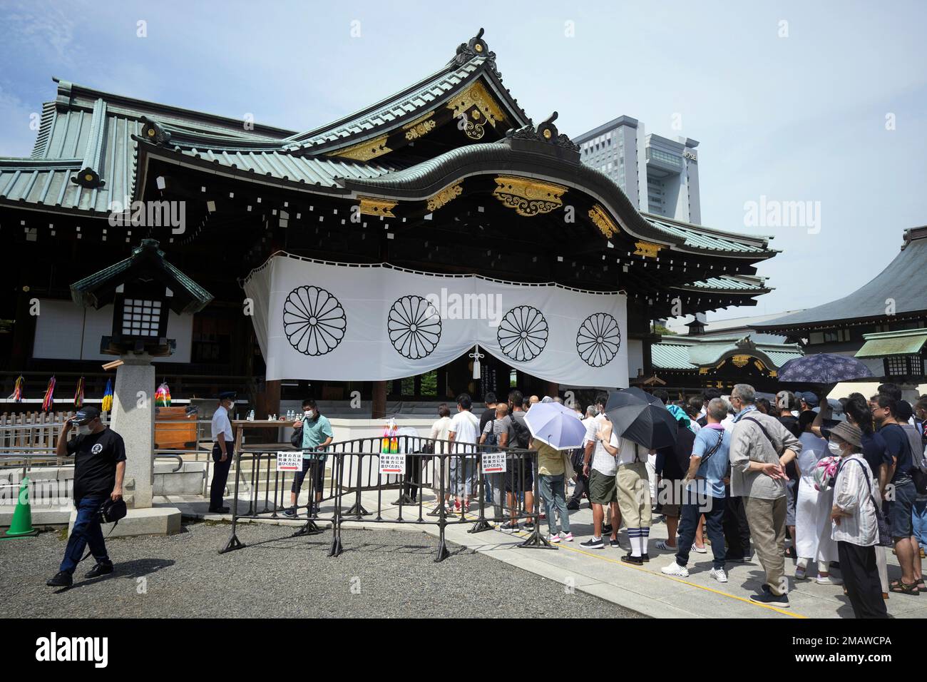 People pay respects to the war dead at Yasukuni Shrine Monday, Aug. 15 ...