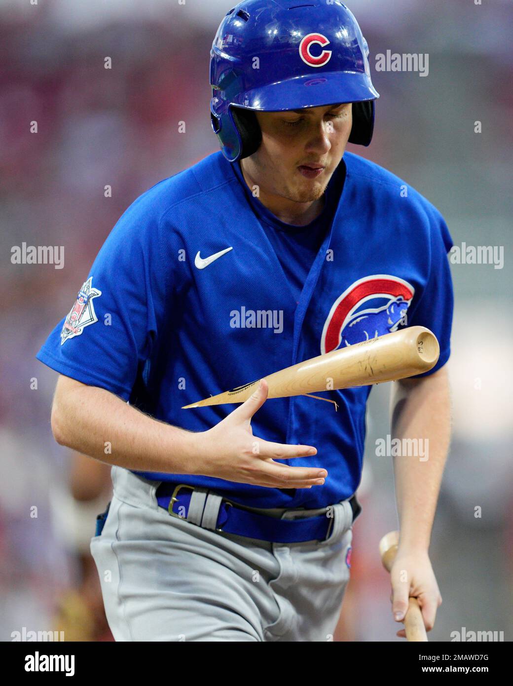 A batboy collets the broken bat of Chicago Cubs' Patrick Wisdom during ...