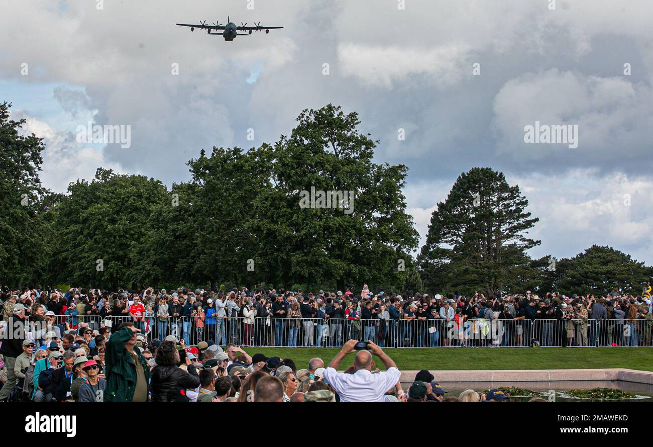 Local citizens and international visitors attend the Normandy American ...