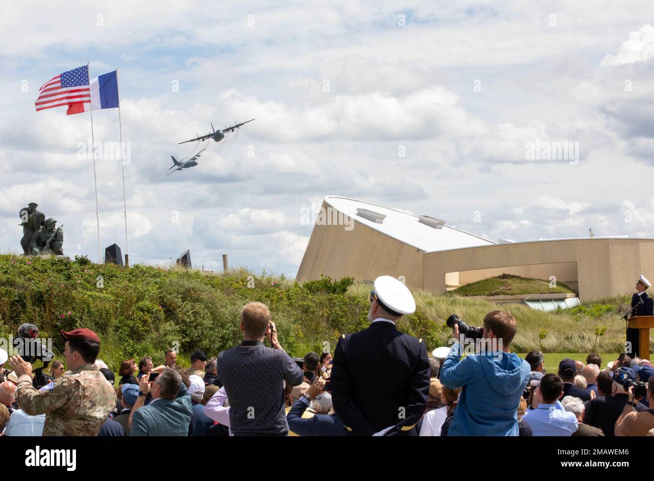 A pair of C-130 Hercules fly over a D-Day ceremony at Utah Beach ...
