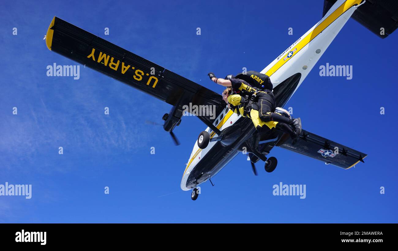 Sgt. 1st Class Ryan Reis of the U.S. Army Parachute Team makes a tandem ...