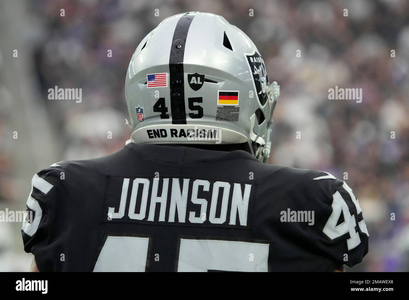 Las Vegas Raiders fullback Jakob Johnson wears a flag on his helmet ...