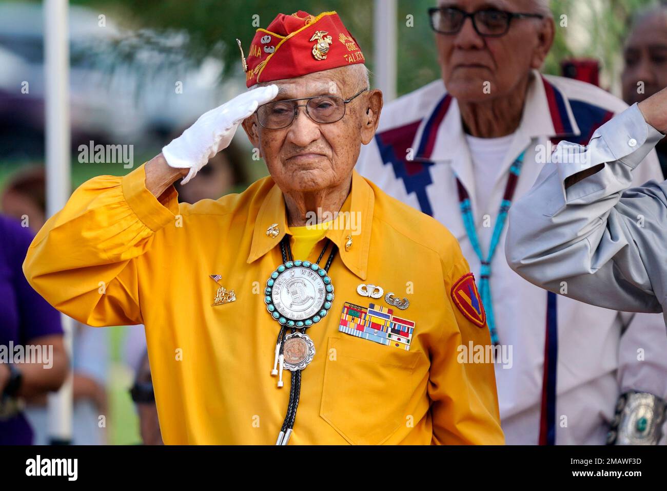 Navajo Code Talker Thomas Begay salutes during the national anthem at ...
