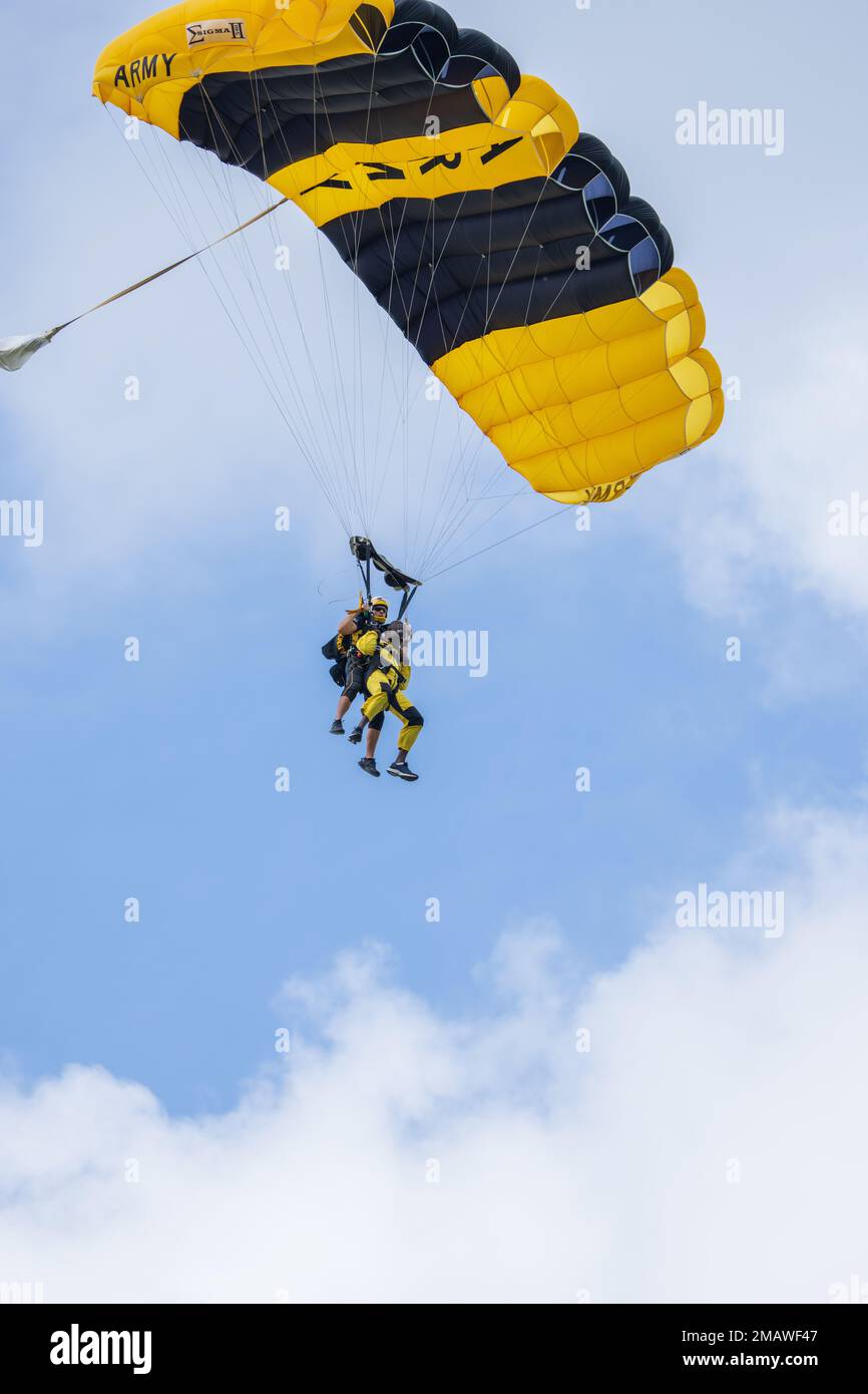 Sgt. 1st Class Ryan Reis of the U.S. Army Parachute Team makes a tandem ...