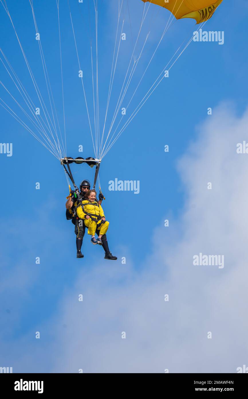 Staff Sgt. Daniel Osorio of the U.S. Army Parachute Team makes a tandem ...
