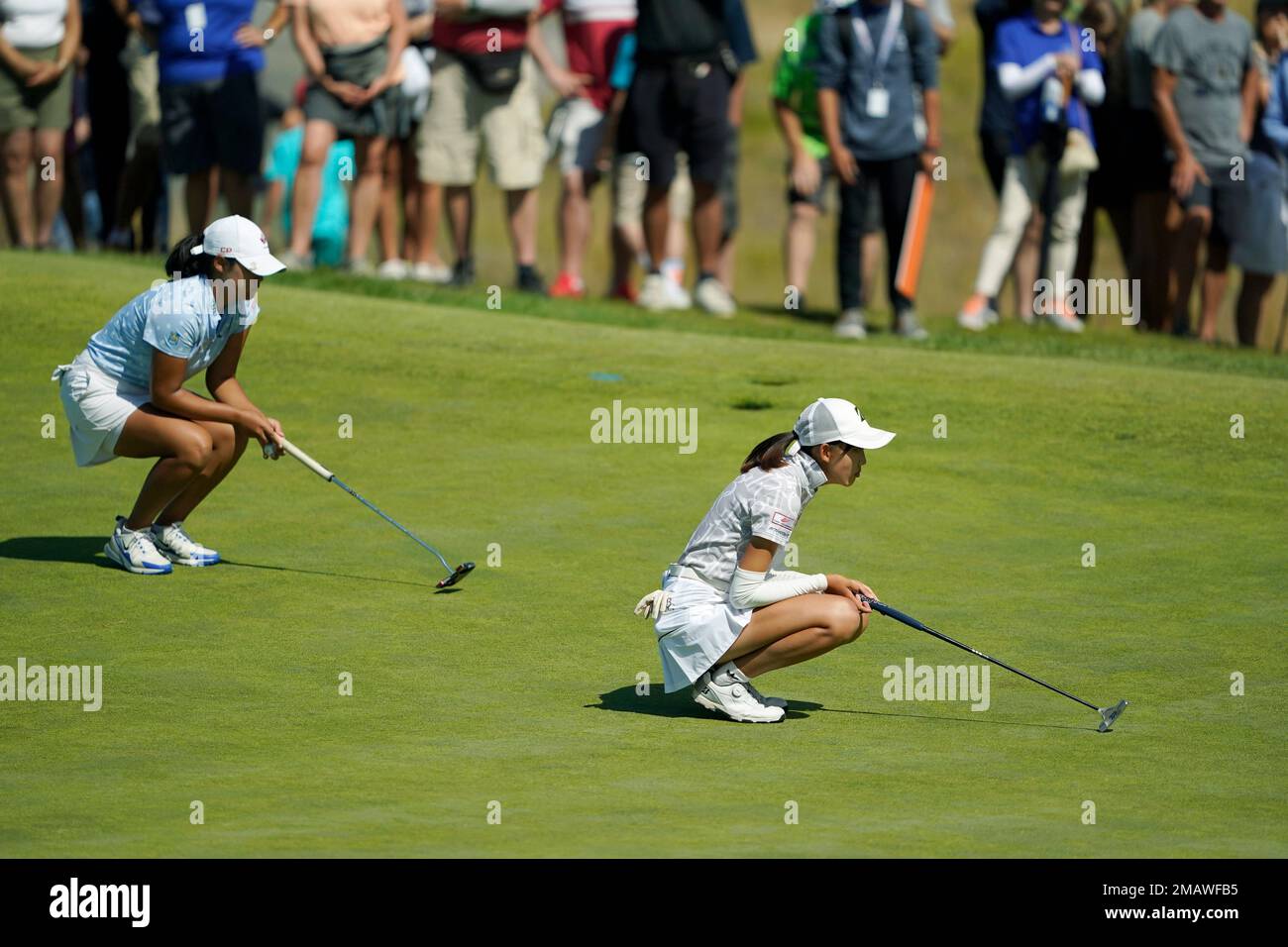 Monet Chun, left, of Canada, and Saki Baba, right, of Japan, line up ...