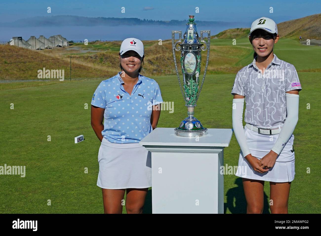 Monet Chun, of Canada, left, and Saki Baba, of Japan, right, pose for a ...