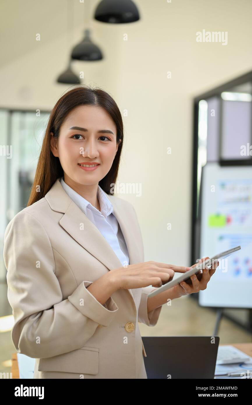 Portrait, Attractive and successful millennial Asian businesswoman or ...