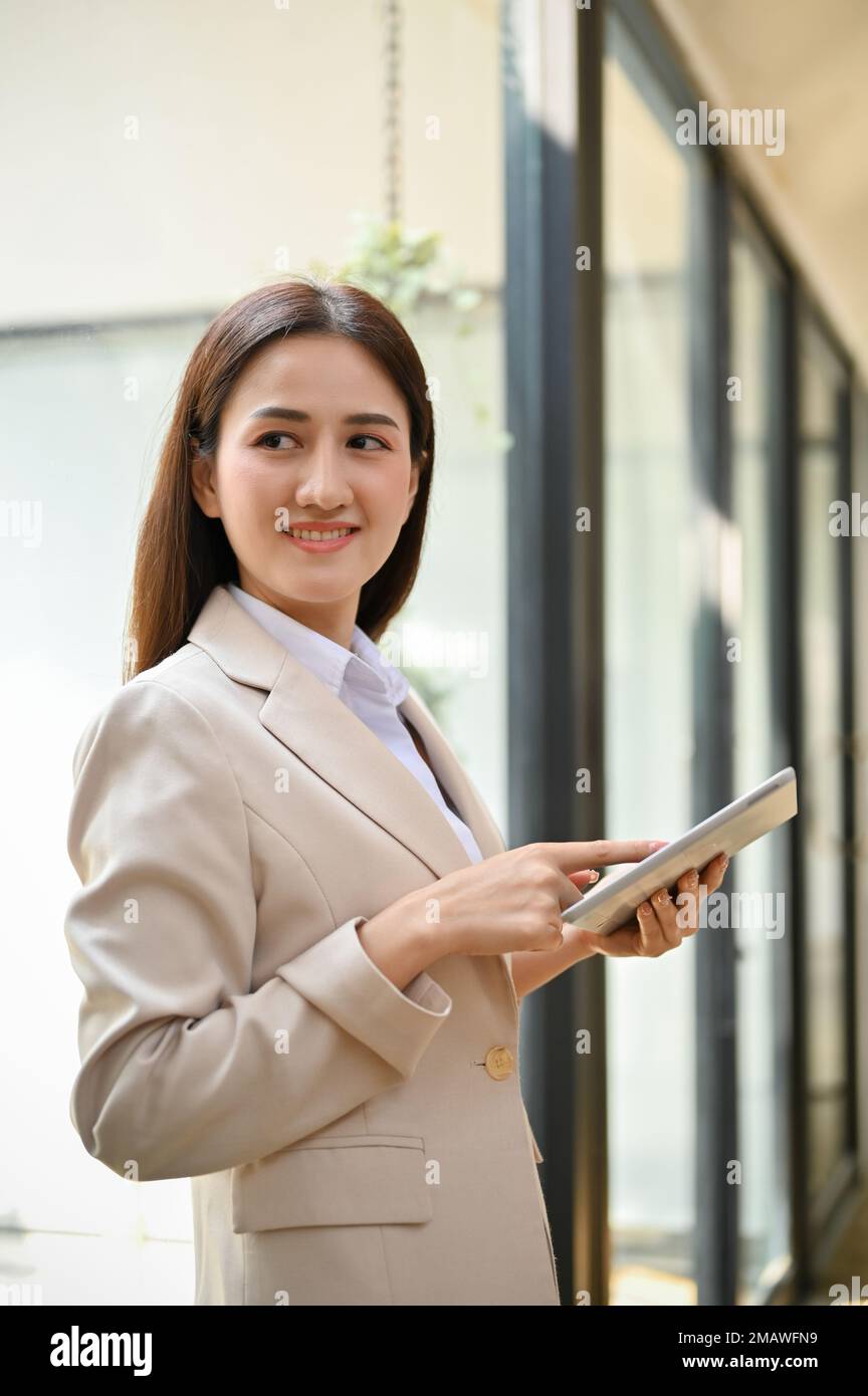 Portrait, Attractive and successful millennial Asian businesswoman or ...