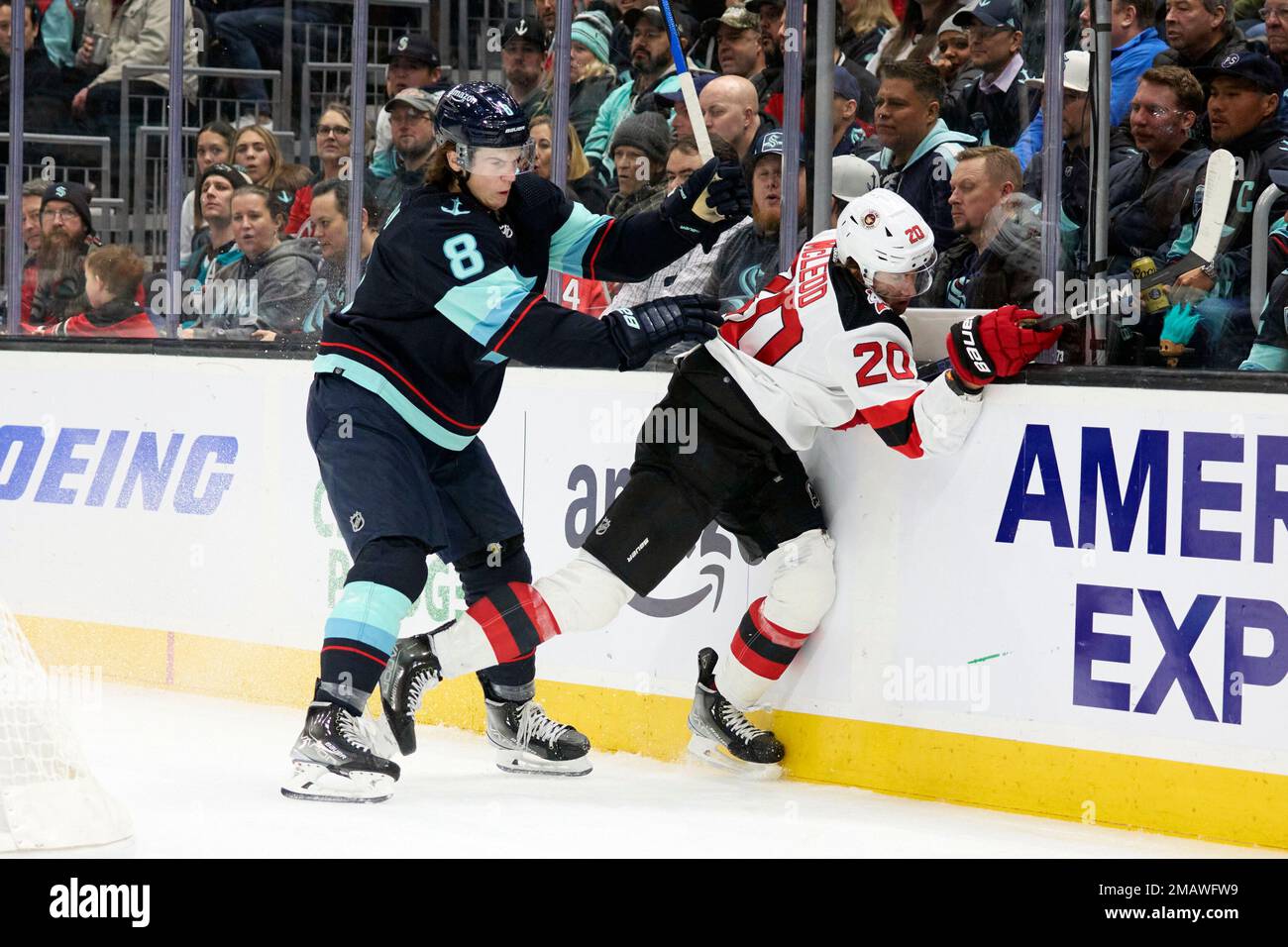 Seattle Kraken defenseman Cale Fleury (8) checks New Jersey Devils ...