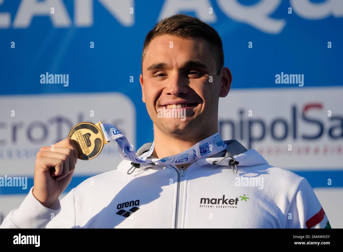 Hungary's Kristof Milak celebrates on the podium after winning the gold ...