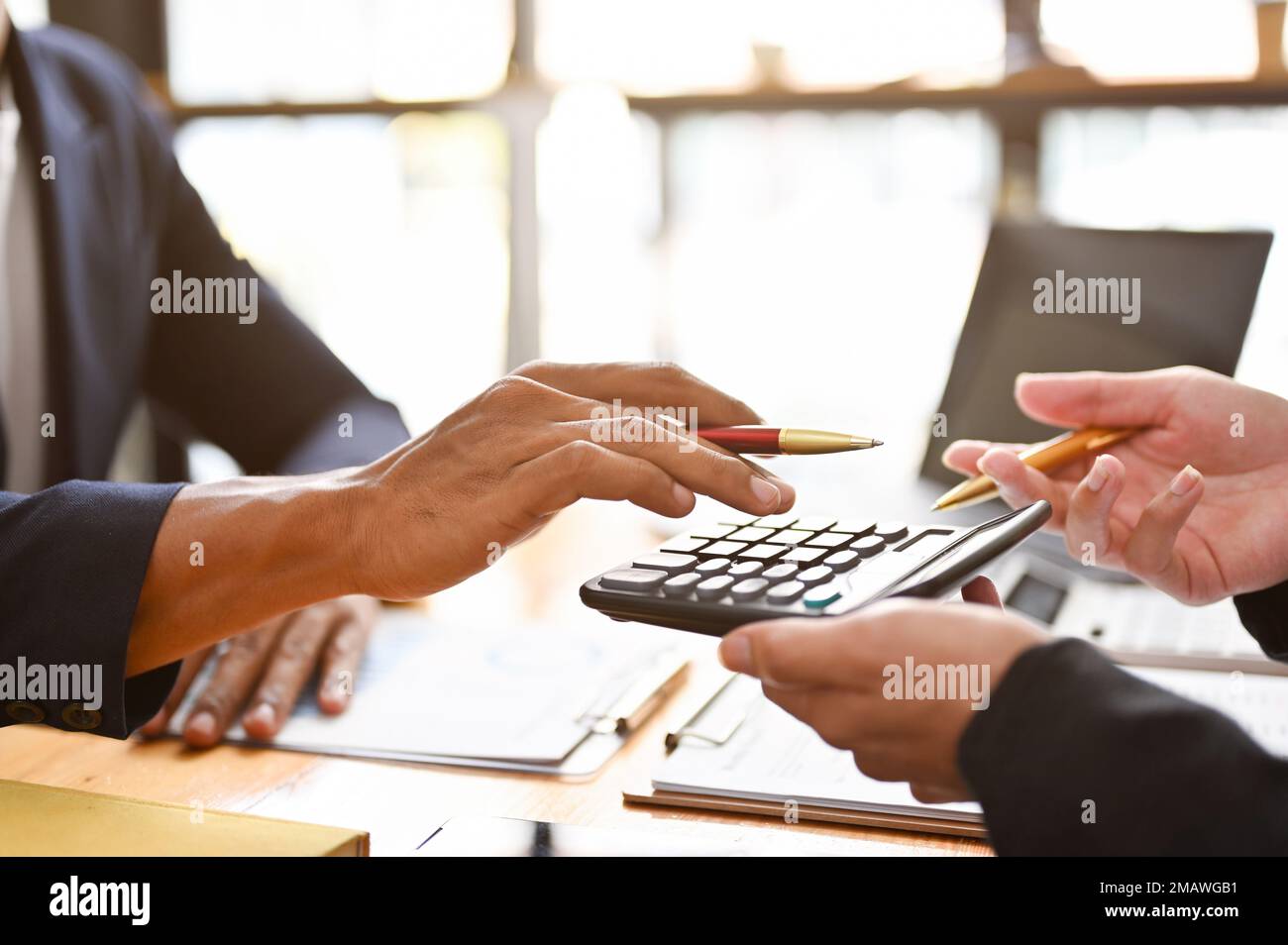 Smart Asian businessman or male accountant discussing and working with ...