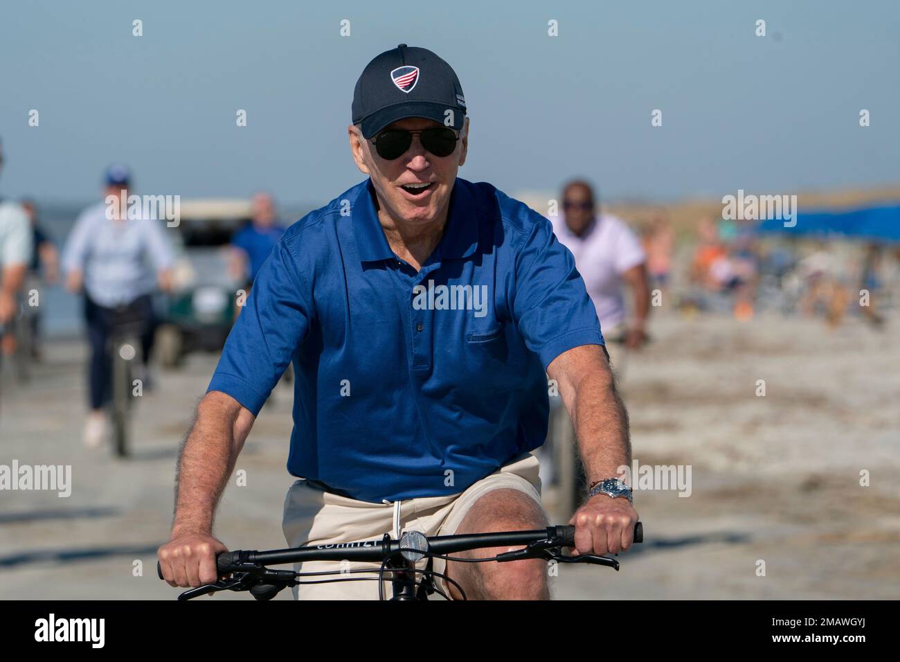 President Joe Biden rides bicycle along the beach at Kiawah Island, S.C ...