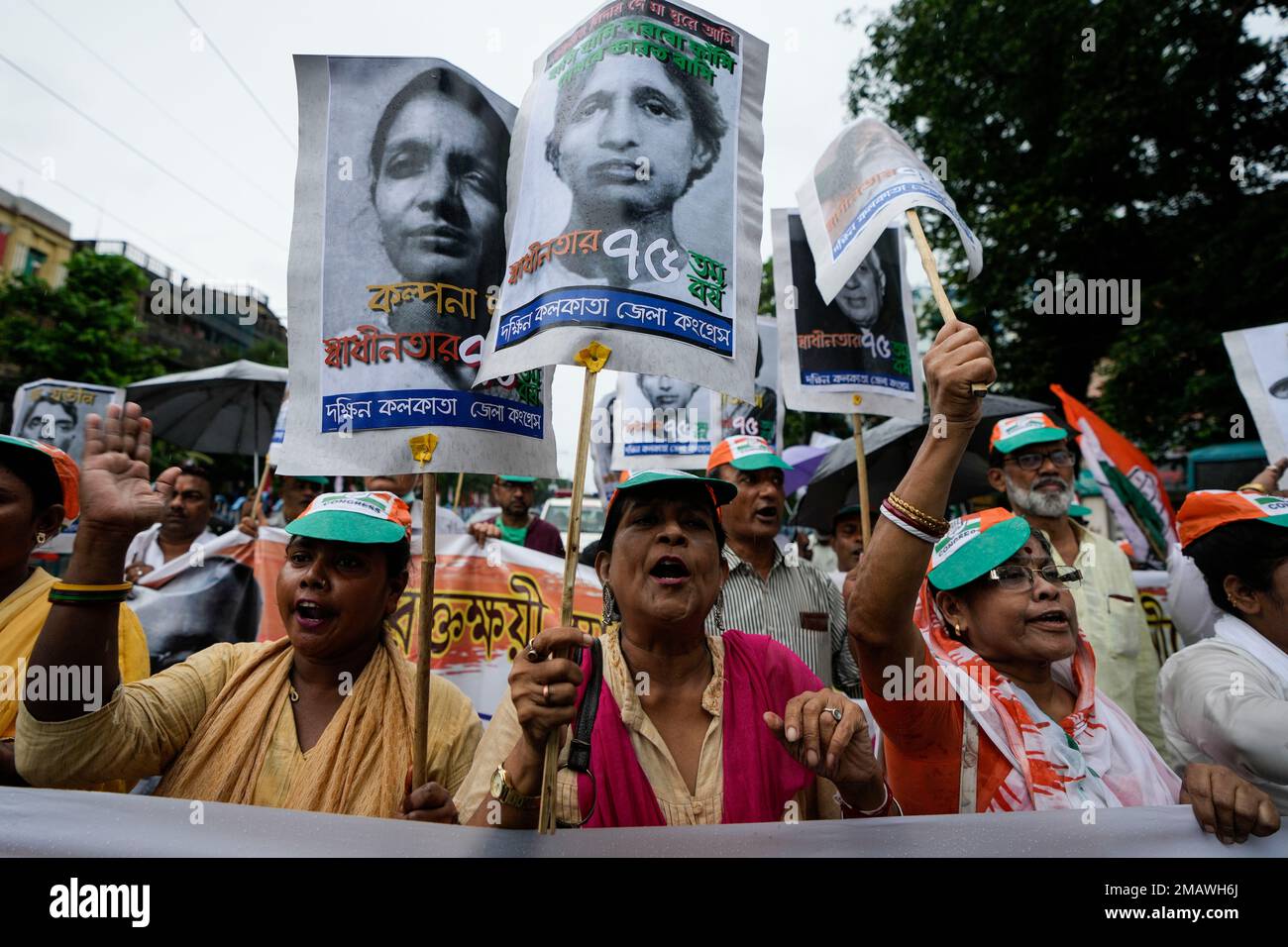 Supporters of Congress Party walk in a rally carrying Indian martyrs ...